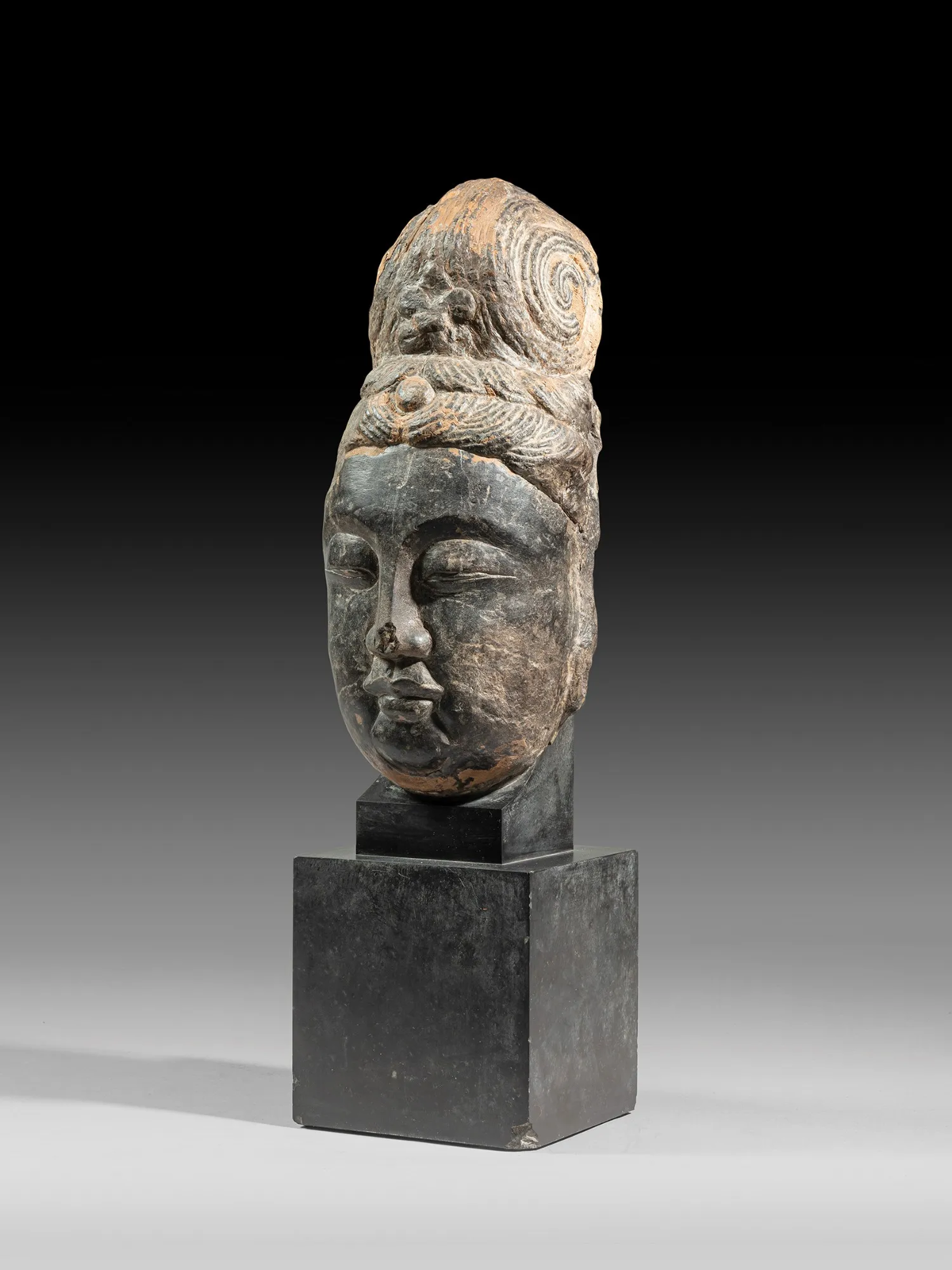A limestone head of a Bodhisattva China, Longmen, Tang dynasty (618-907 ...
