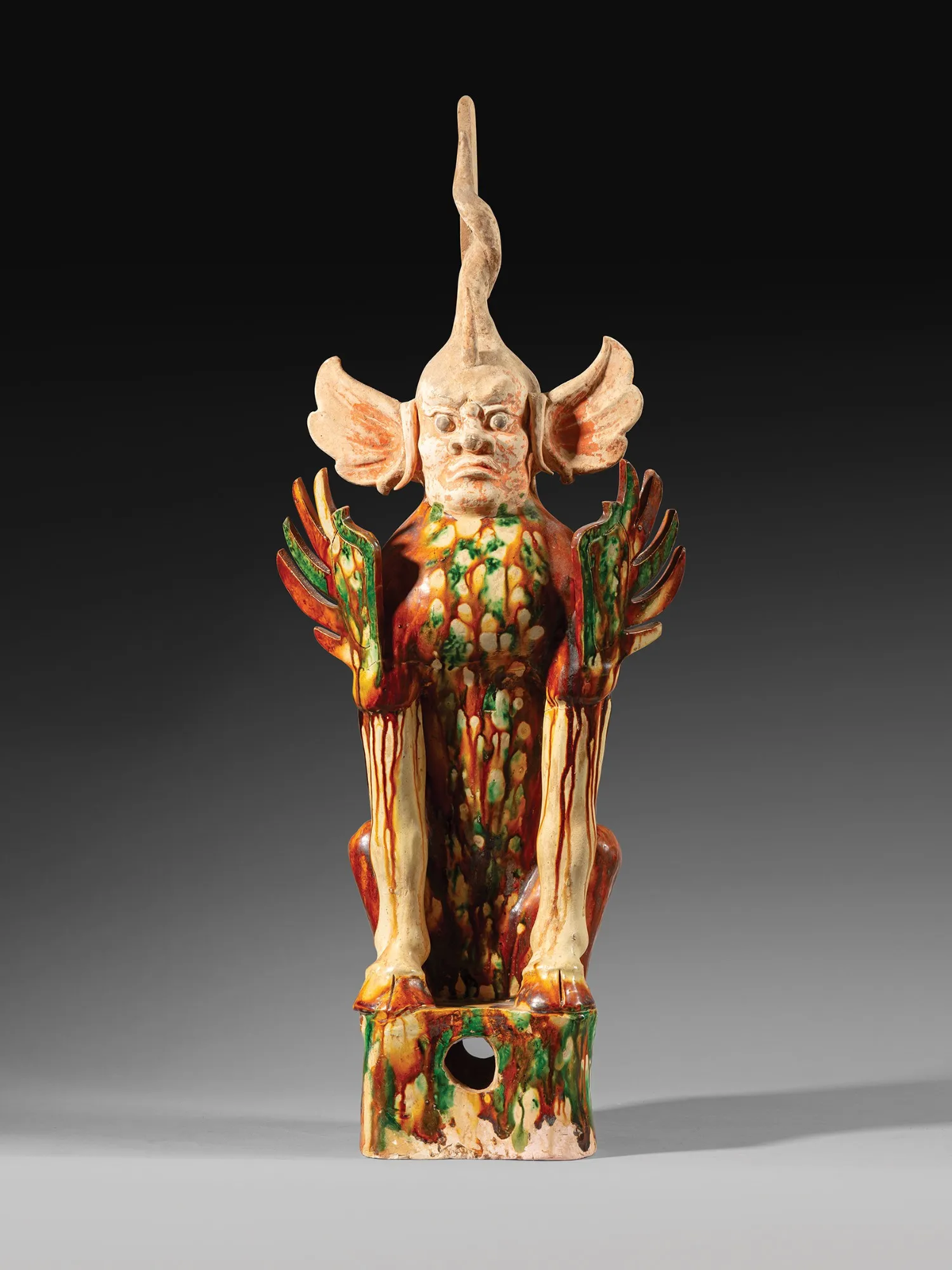 A 'Sancai' glazed pottery figure of a tomb guardian, 'Zhenmushou', Tang ...