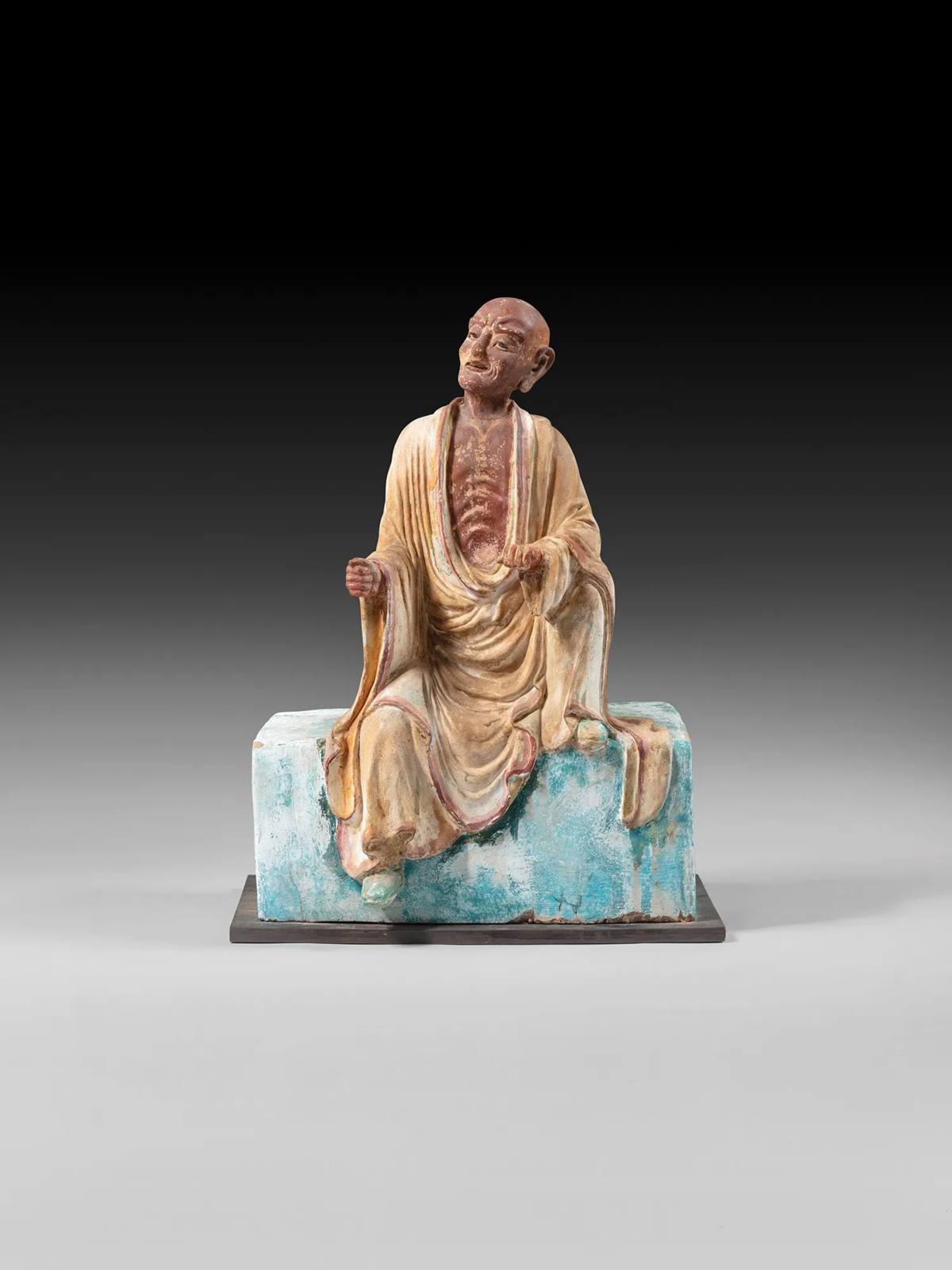 A polychrome stucco figure of a seated luohan, Late Ming dynasty-Early ...