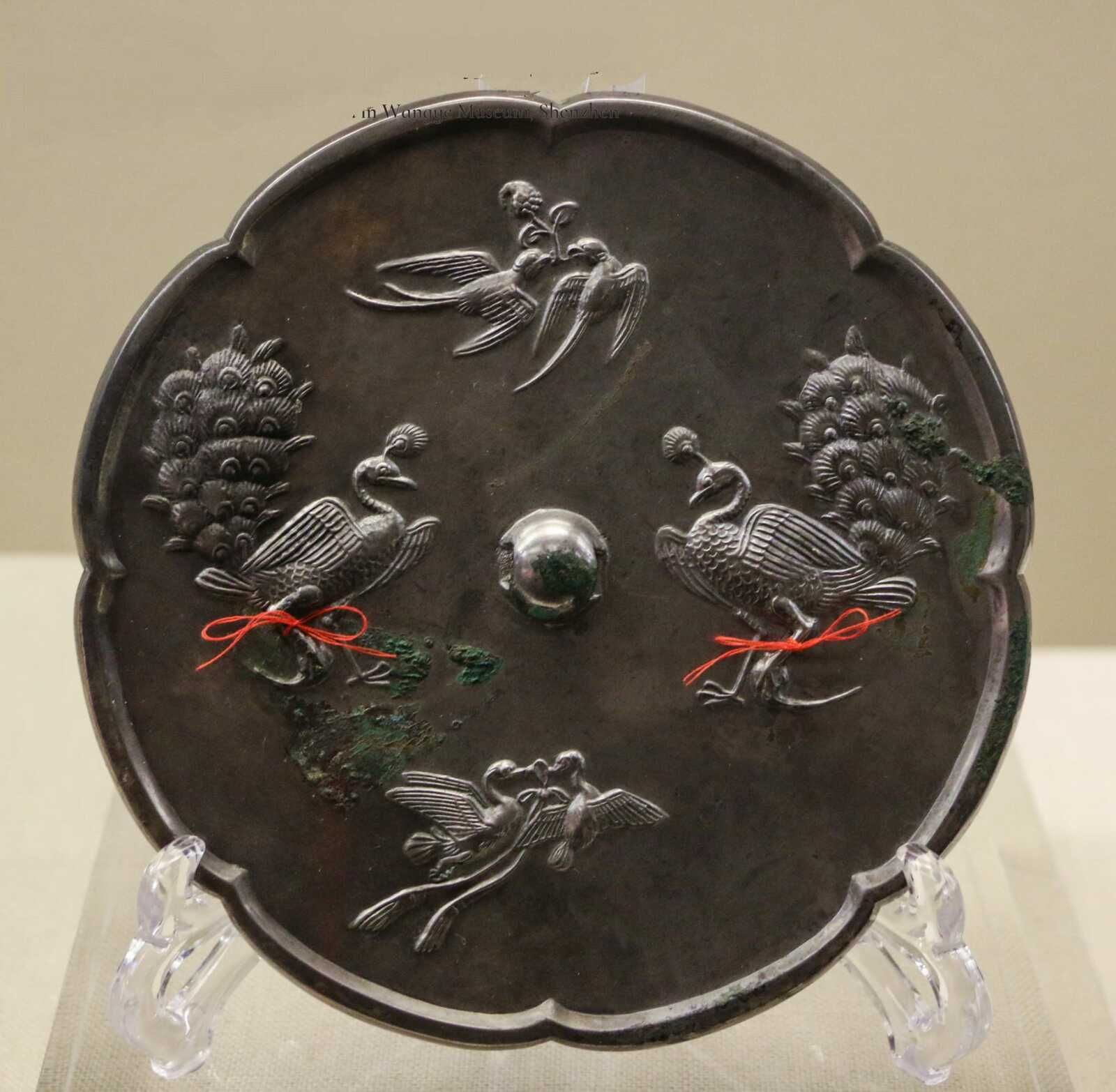 Bronze mirror with design of peacocks and birds, Tang Dynasty (618-907 ...