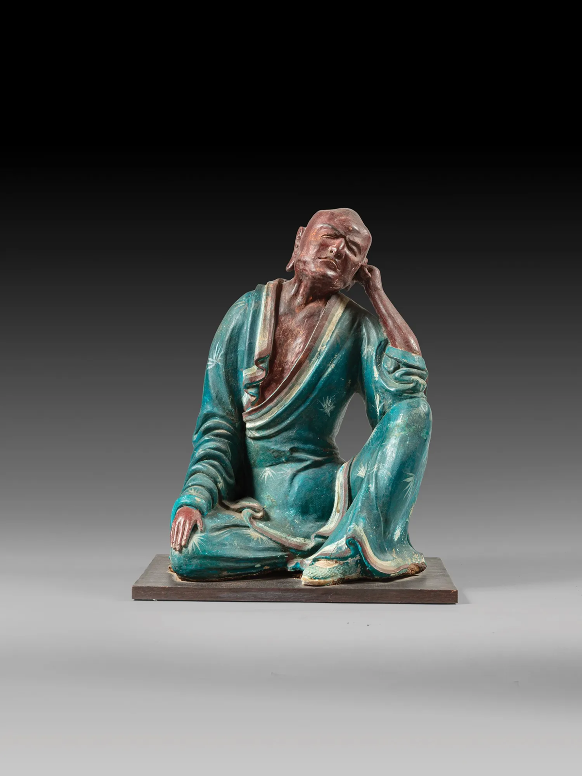 A polychrome stucco figure of a seated luohan, Late Ming dynasty-Early ...