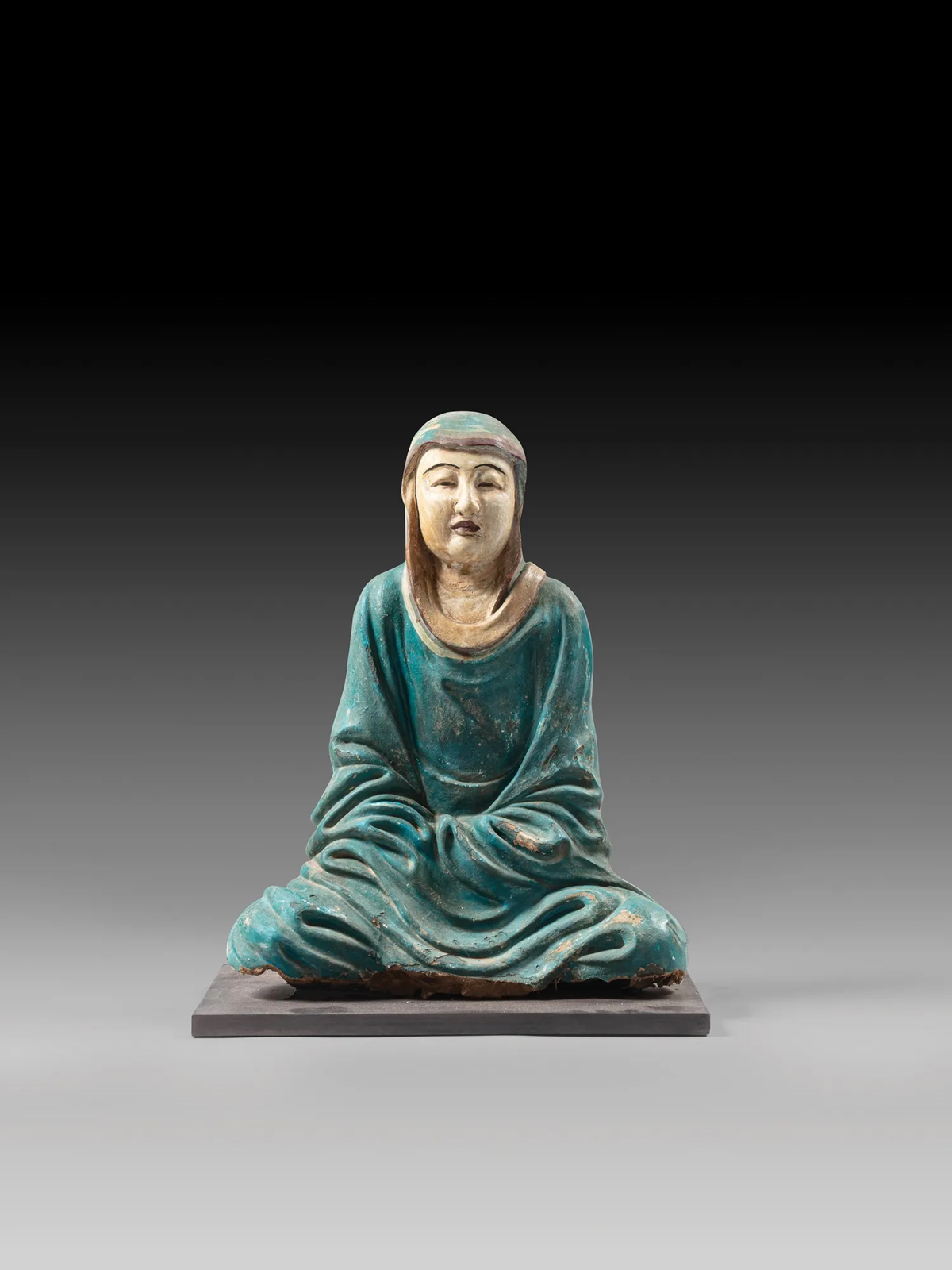 A polychrome stucco figure of a seated luohan, Late Ming dynasty-Early ...