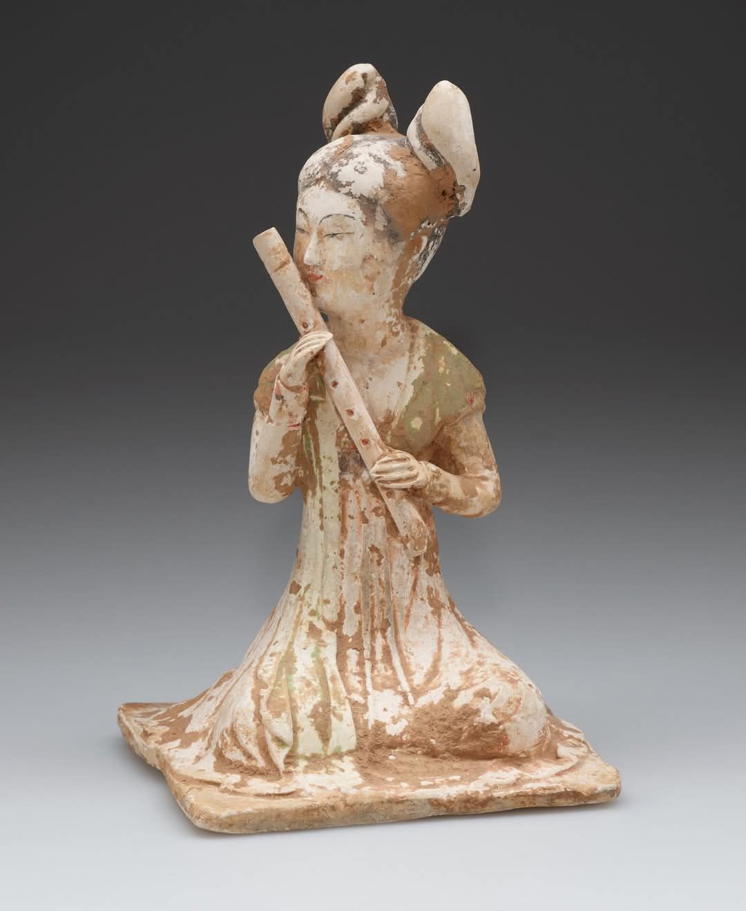 Tomb Figure Representing a Musician Playing a Bamboo Flute, Tang ...